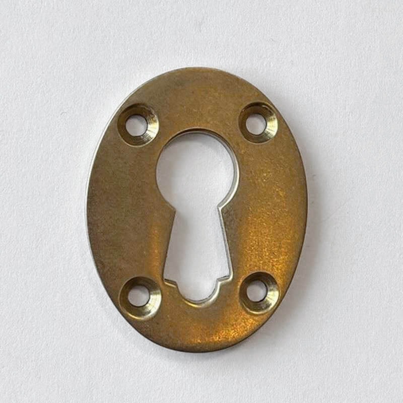 Oval Rim Lock Escutcheon Aged Brass - Broughtons Lighting & Ironmongery