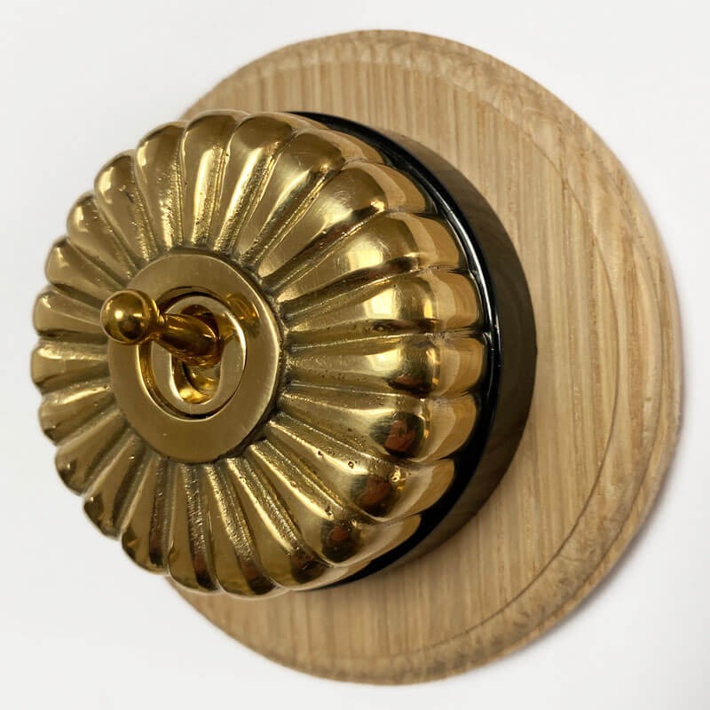 Fluted Round Dolly Light Switch 1 Gang Polished Brass Black Base ...
