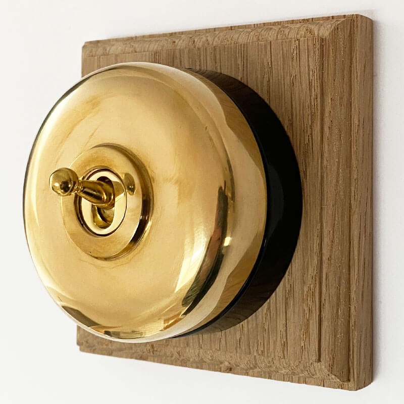 Round Dolly Light Switch 1 Gang Polished Brass Black Base - Broughtons ...